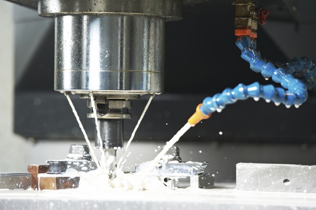 milling the metal blank with coolant - Alart Machine